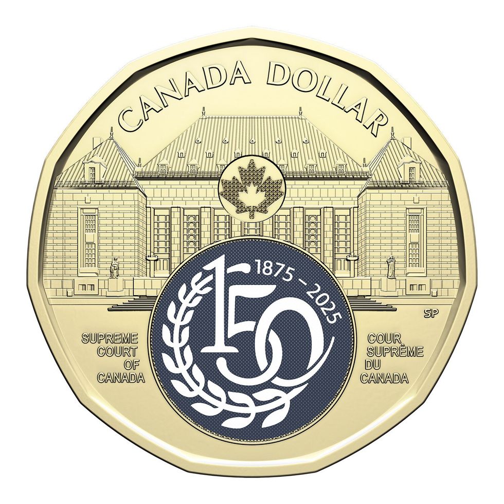 Canada's new $1 coin has blue and white accents along with an engraving ...
